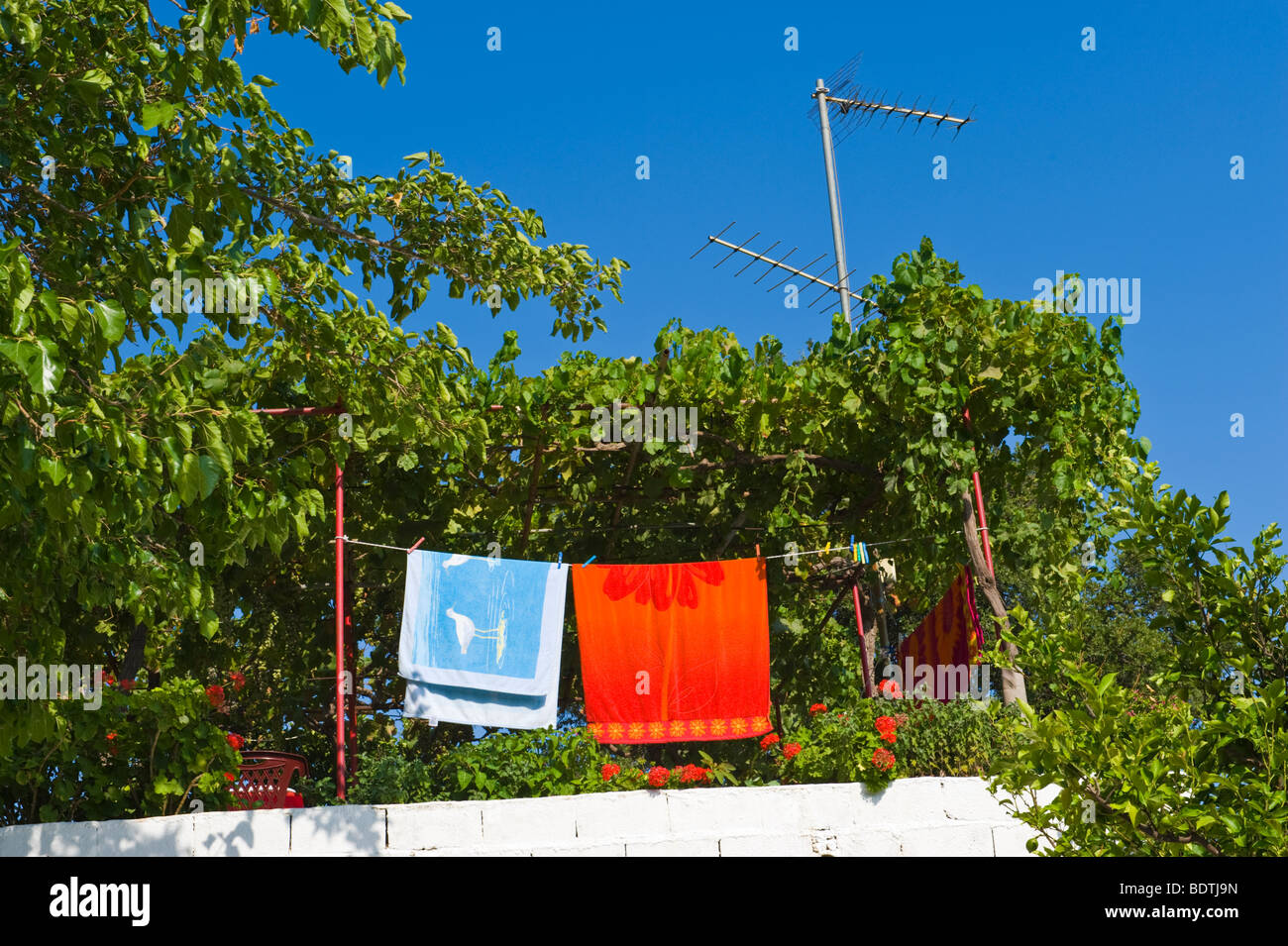 Towels hanging on washing line in village of Pastra on the Greek ...