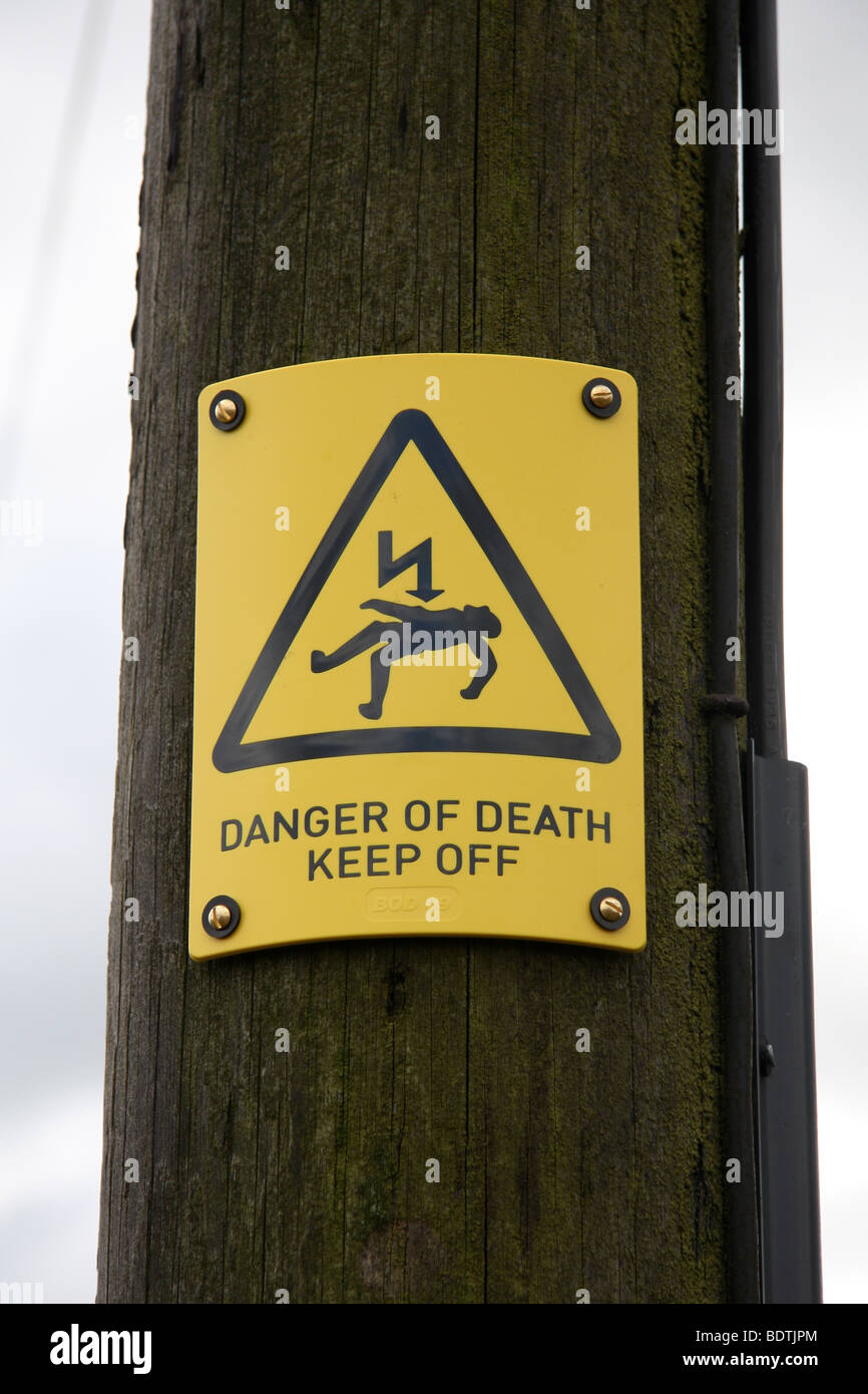 Sign warning of electric cables Stock Photo - Alamy