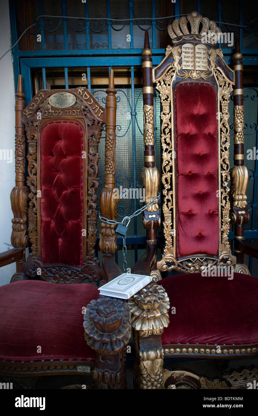 Decorated wooden chairs for Bride and Groom chained together inside a ...