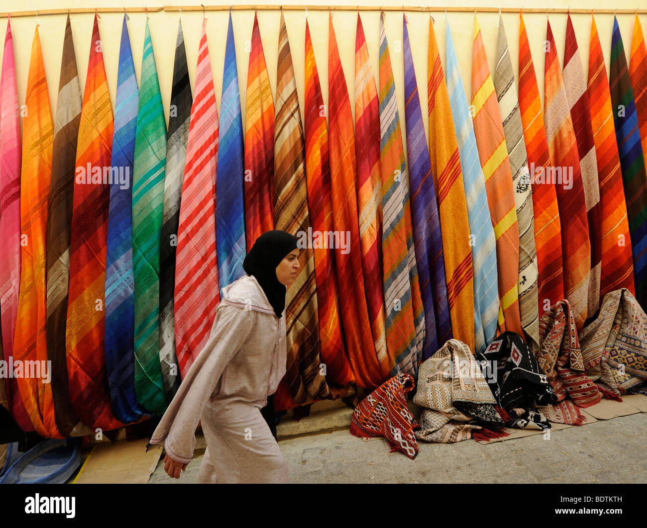 Multicoloured fabrics in the streets at the Medina in Fes/Fez pictured ...