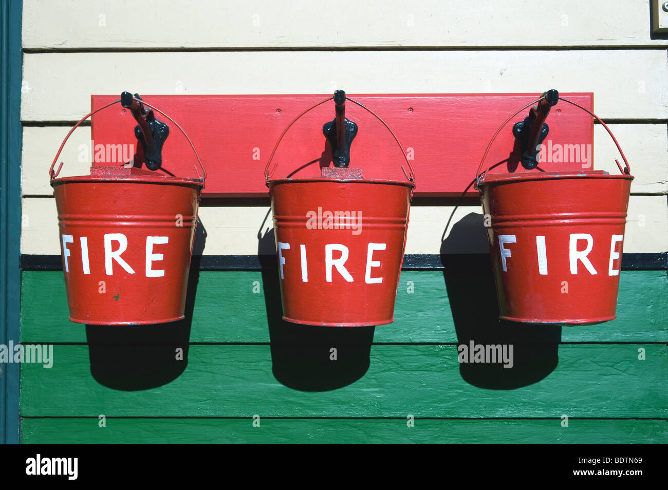 Fire buckets in a row Stock Photo - Alamy