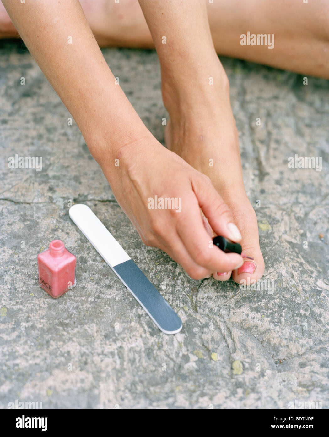 Woman using feet hands hand hi-res stock photography and images - Alamy