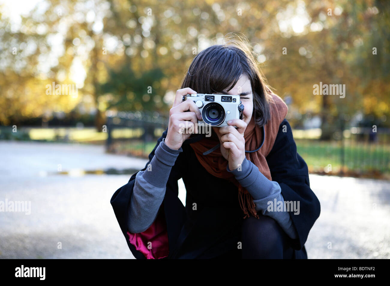A woman taking a picture London Stock Photo - Alamy
