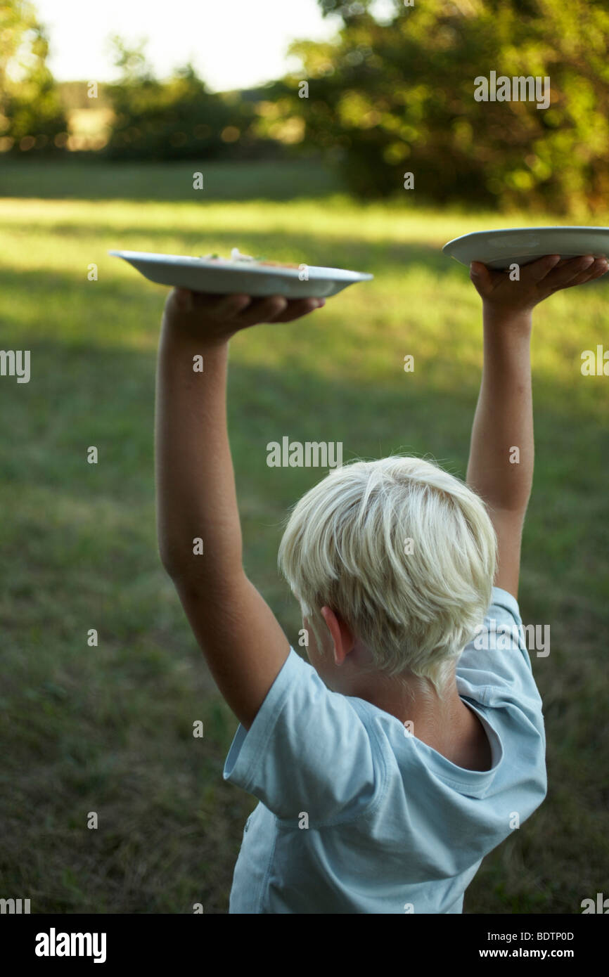 School dinner plate carrying hi-res stock photography and images - Alamy