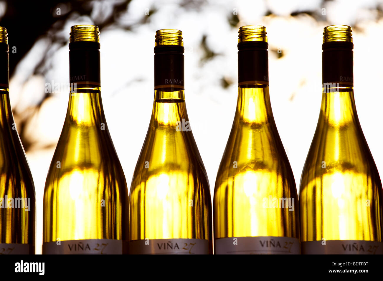 Bottles in a row Stock Photo - Alamy