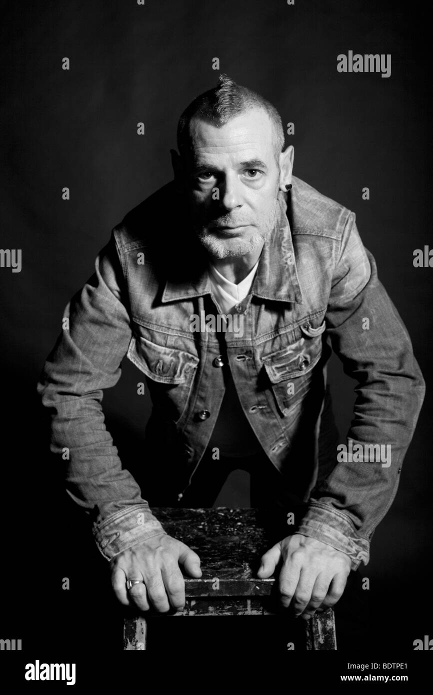 Alternative looking man taking a powerful position of dominance Stock ...