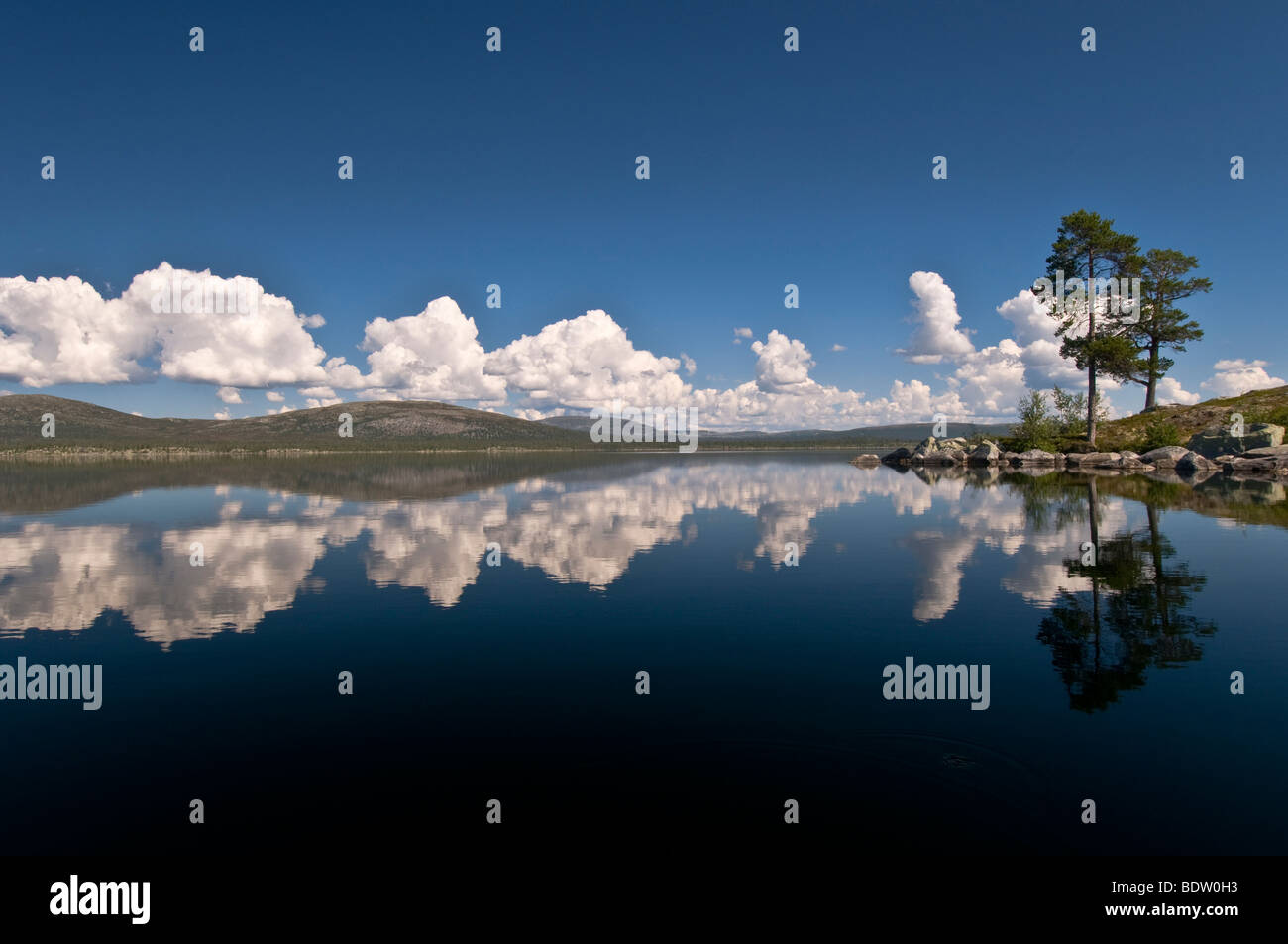Mirroring clouds in lake rogen, nature reserve, sweden Stock Photo - Alamy