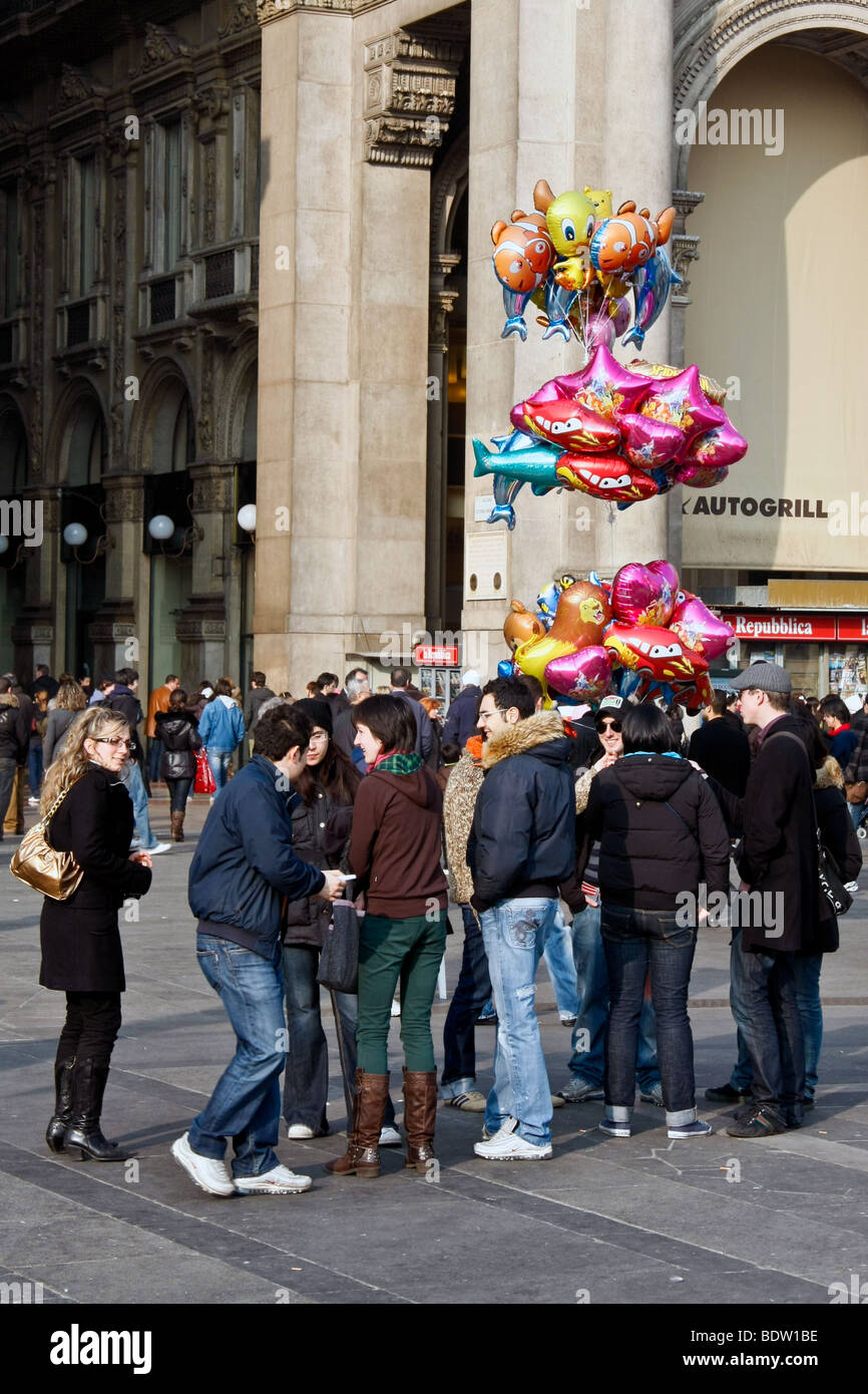 Friends chatting and passing the time of day in Milan Stock Photo - Alamy