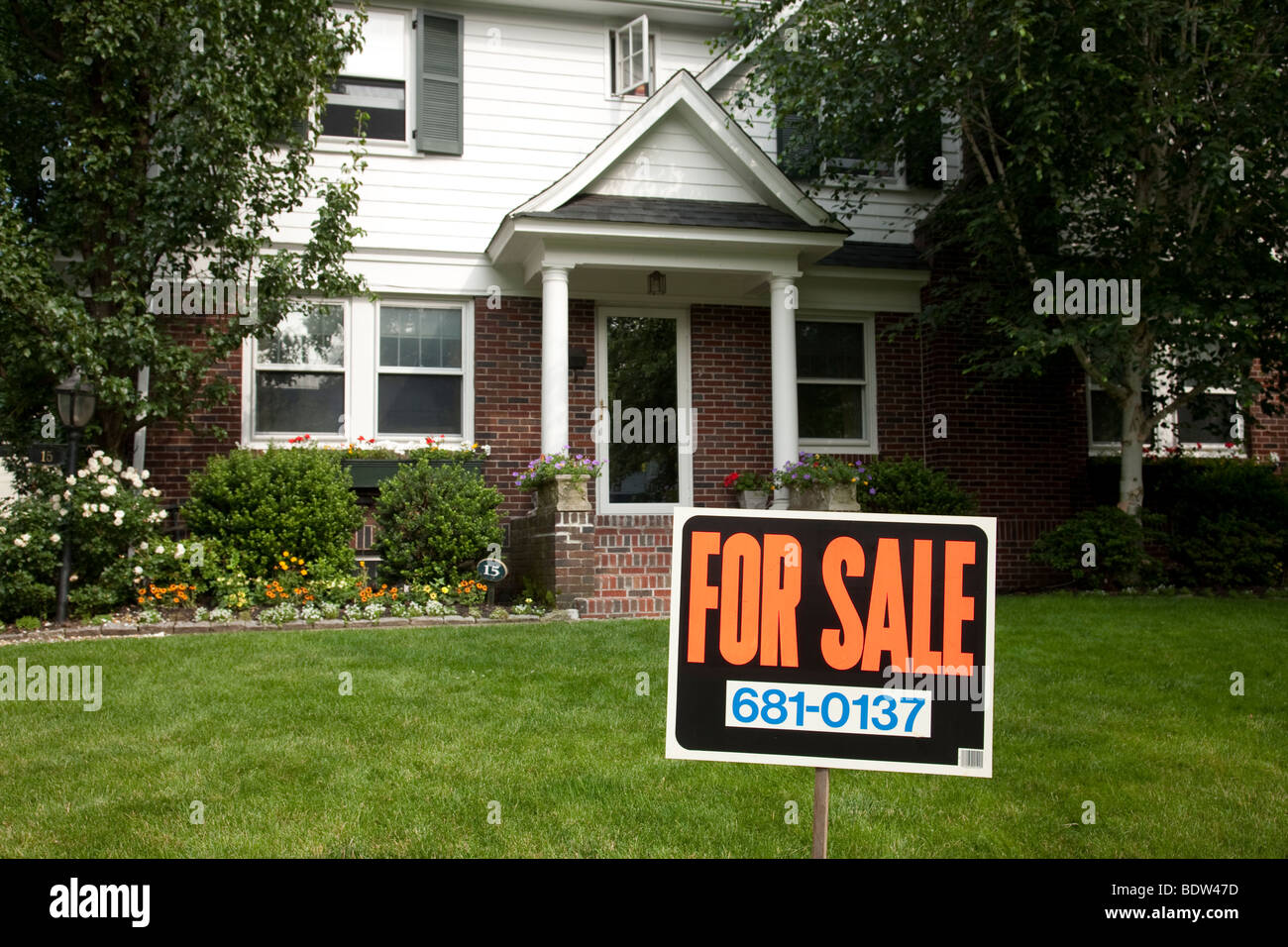 Suburban House and For Sale Sign Stock Photo - Alamy