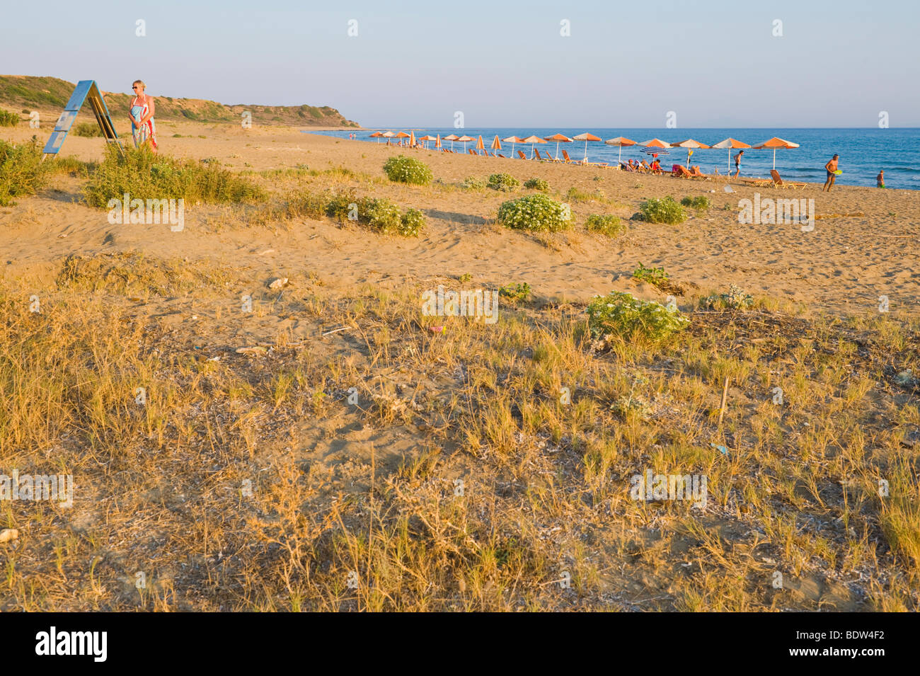 View over the blue flag Mounda beach in early evening light on the ...