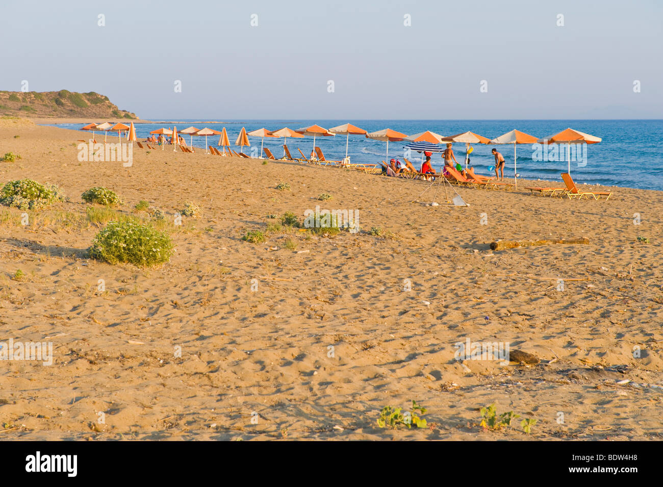 View over the blue flag Mounda beach in early evening light on the ...