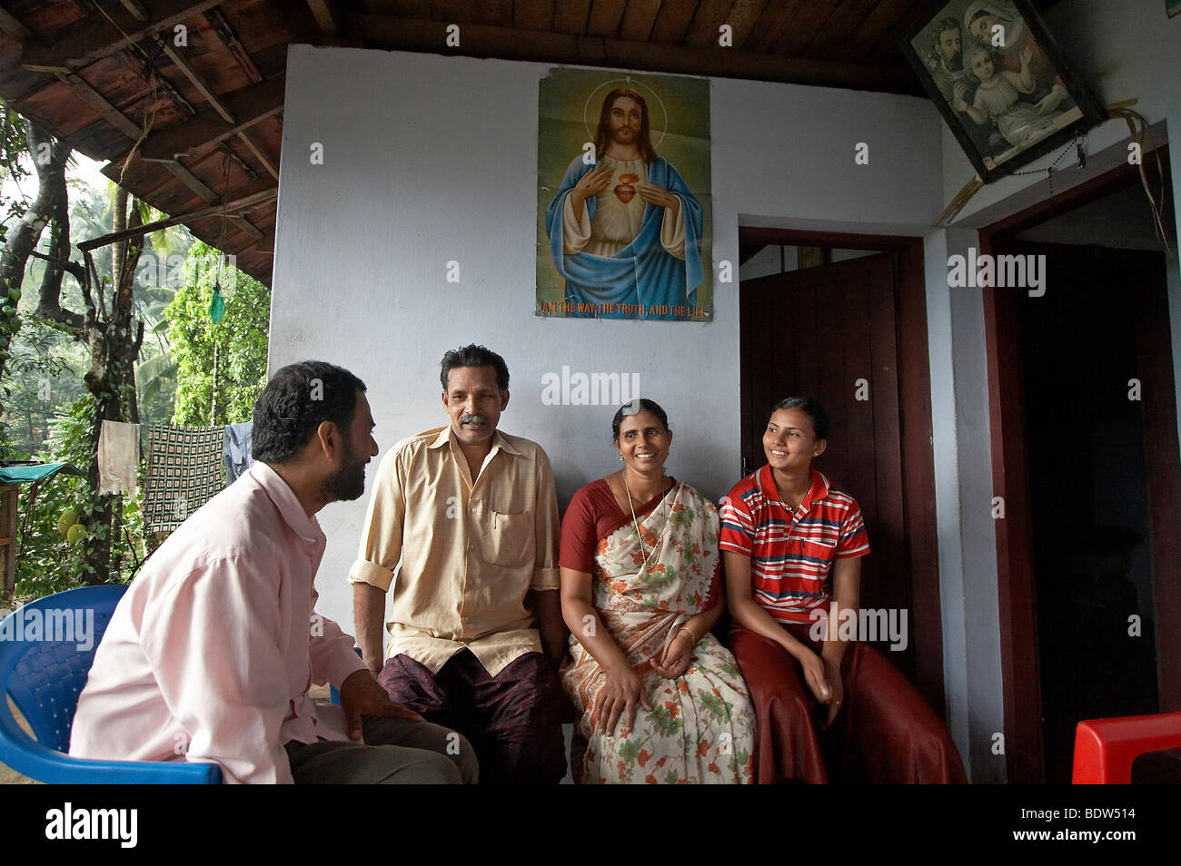 INDIA Catholic priest viisitng villagers, Kerala Stock Photo - Alamy