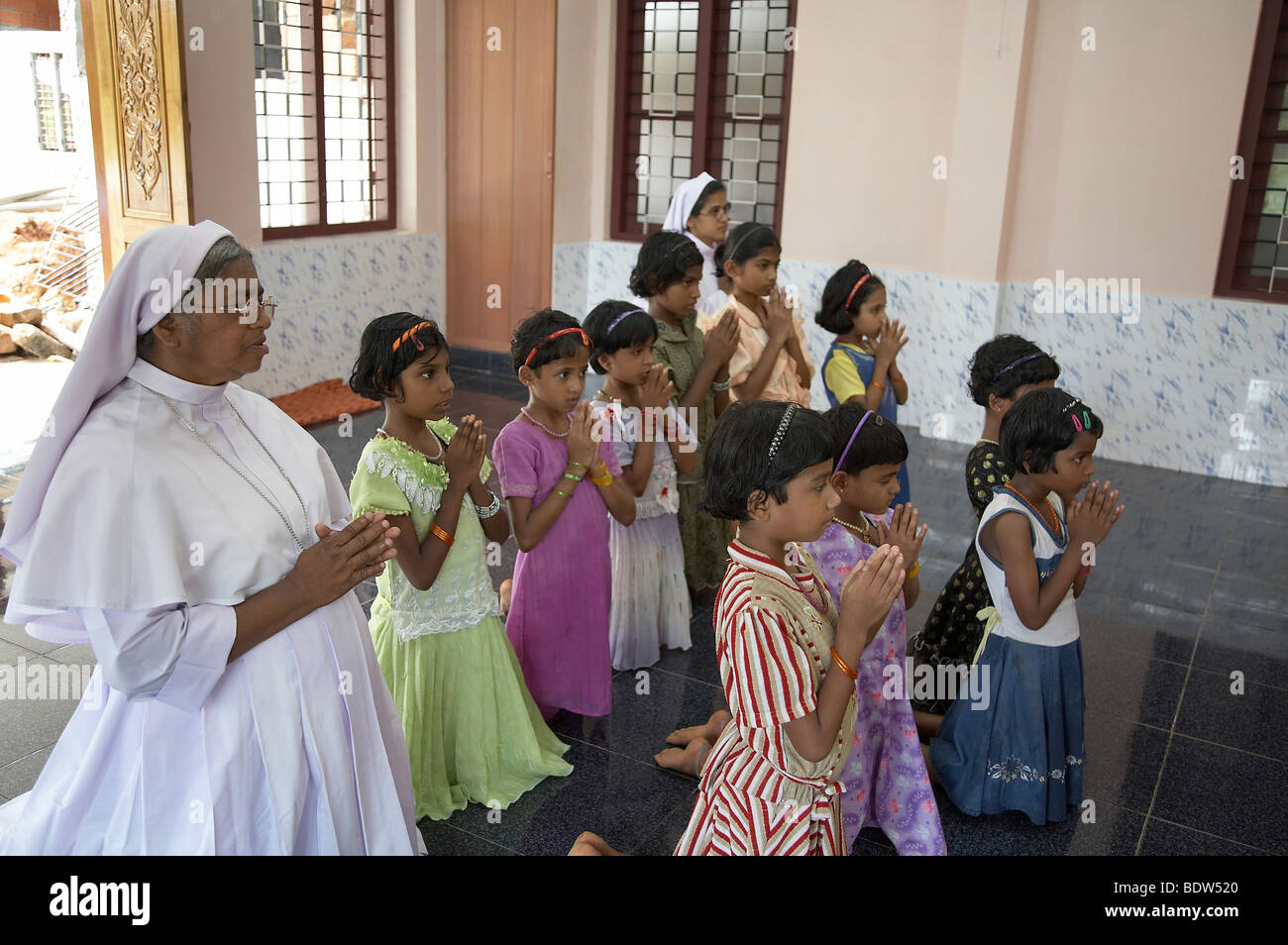 INDIA Nuns and girls at prayer. Mary Matha Bala Bhavan, a girls ...