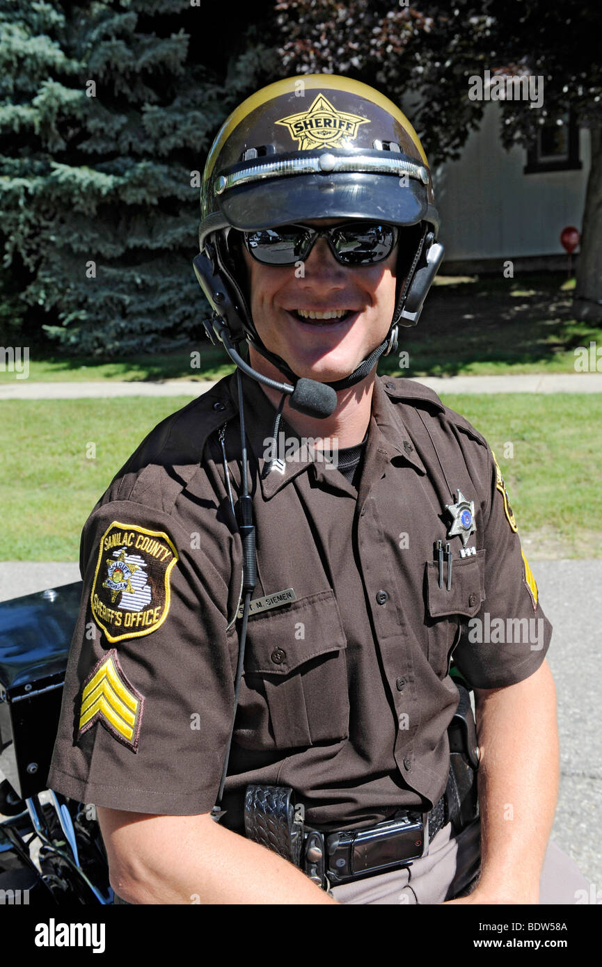 Uniformed County Sheriff with badge and patches Stock Photo - Alamy