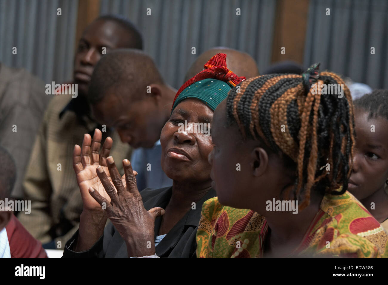KENYA Faces of the congregation at Catholic mass in Mukuru Ruben, a ...