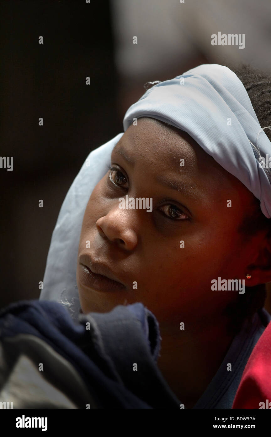 KENYA Faces of the congregation at Catholic mass in Mukuru Ruben, a ...