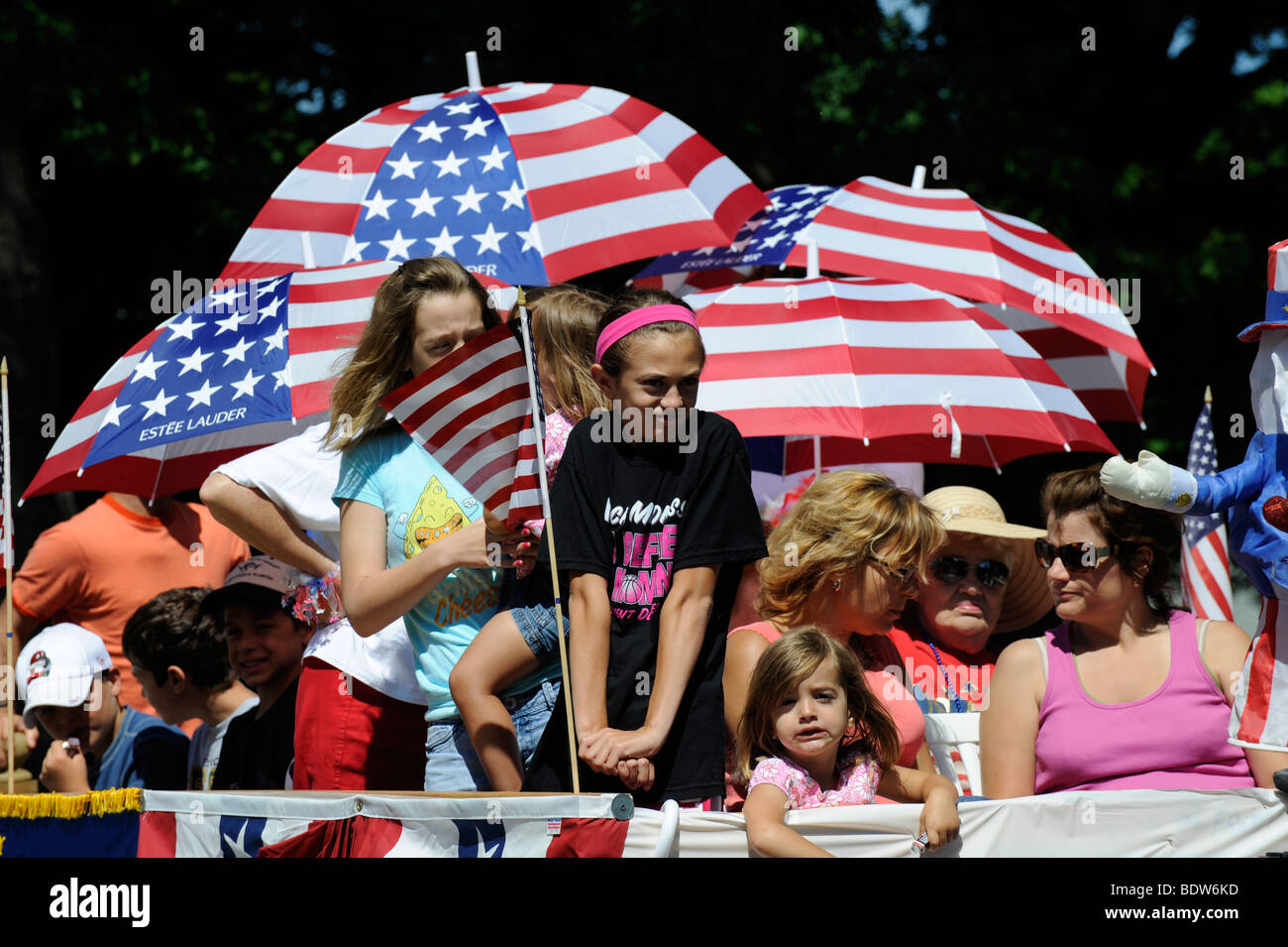 Crowd with flags and umbrellas watched patriotic parade Stock Photo - Alamy