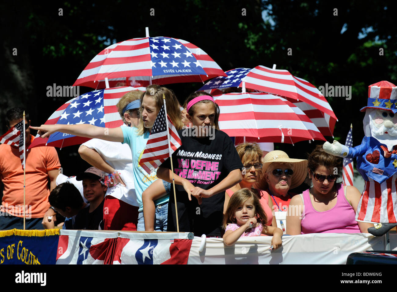 Crowd with flags and umbrellas watched patriotic parade Stock Photo - Alamy