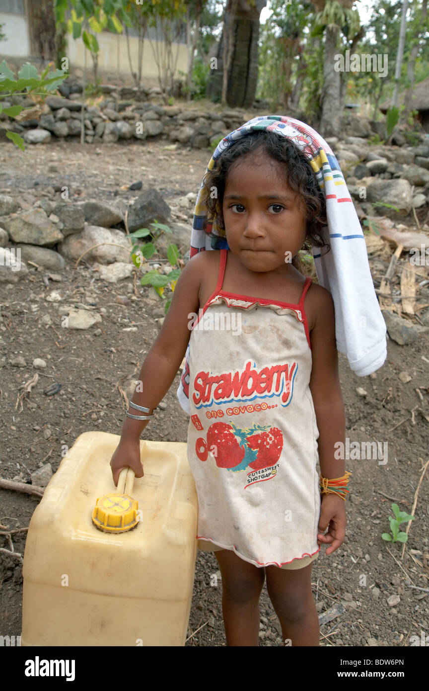 TIMOR LESTE Girl carrying water container, Oecussi-Ambeno PHOTOGRAPH by ...