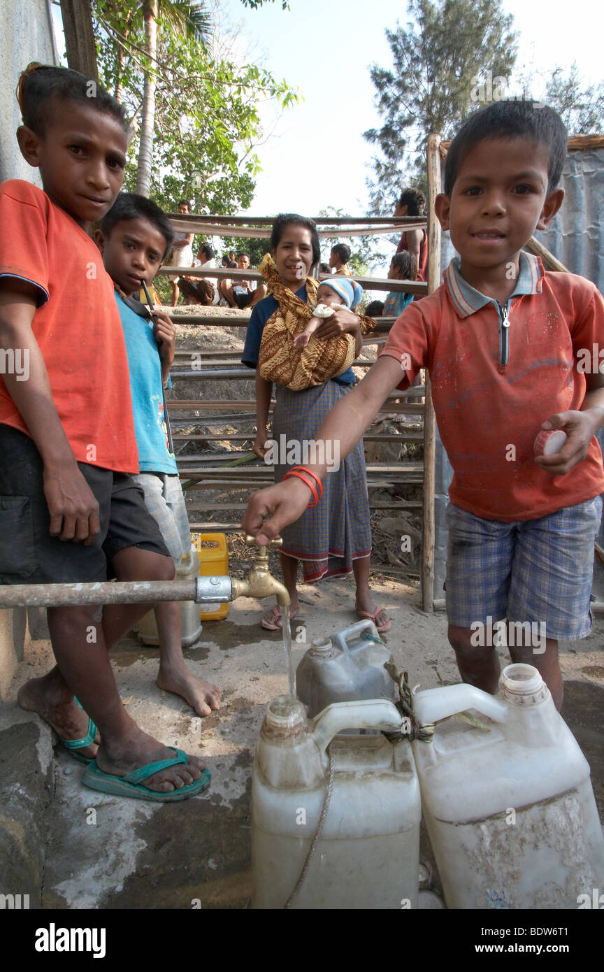 TIMOR LESTE Collecting water from public tap at Kefua village, Oecussi ...