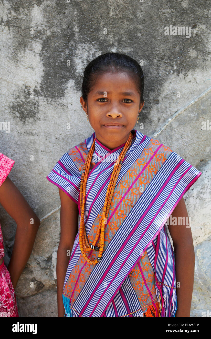 TIMOR LESTE Girl wearing traditional dress including ikat weaves and ...