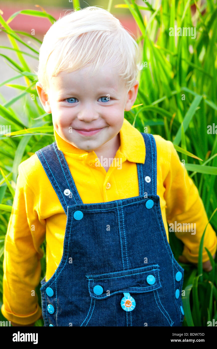 the little boy is happy to look poses before the camera Stock Photo - Alamy