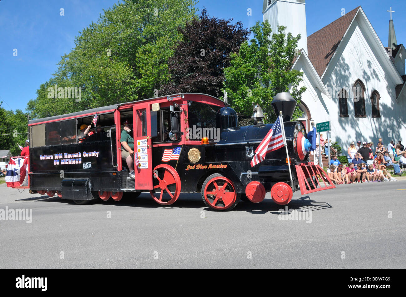 Replica train in patriotic parade Stock Photo - Alamy