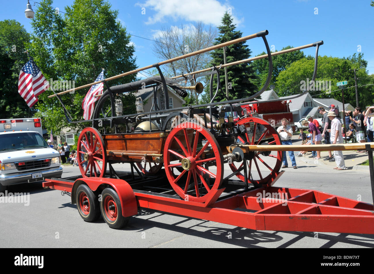 Antique fire engine on float in patriotic parade Stock Photo - Alamy