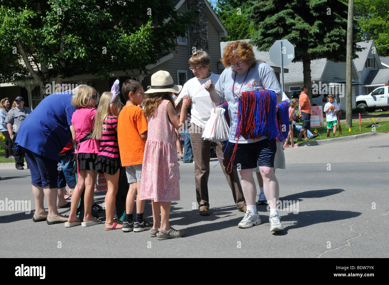 Children receiving candy hi-res stock photography and images - Alamy
