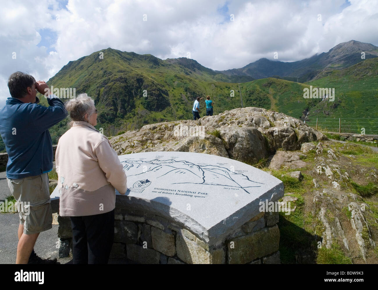 People looking out at Snowdon from a parking area above Nant Gwynant ...