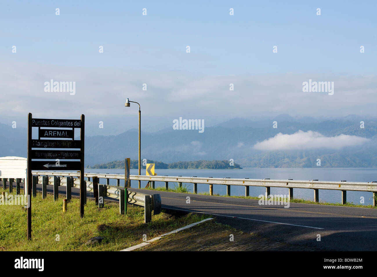 The road that runs a cross the Arenal dam at the head of Lake Arenal in ...