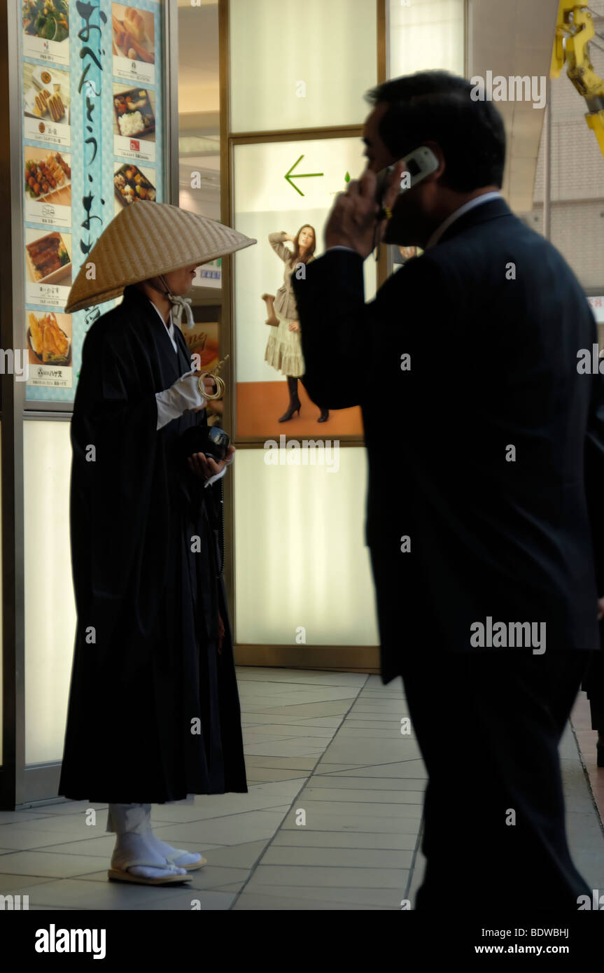 Japanese mendicant monk (O-Bou-san) collecting alms, Shinagawa Station ...