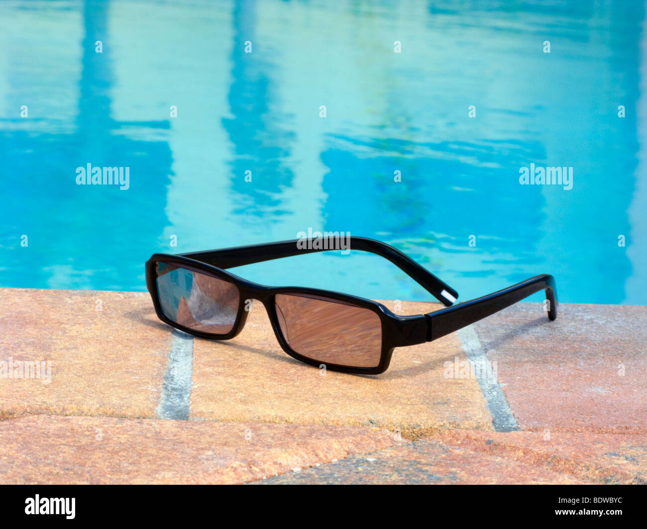 sunglasses by a pool Stock Photo - Alamy