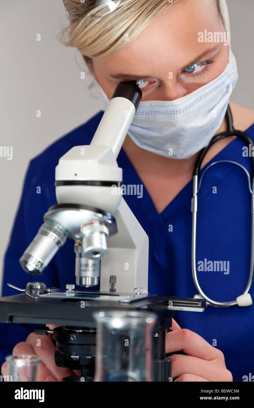 Analysis science woman microscope hi-res stock photography and images ...