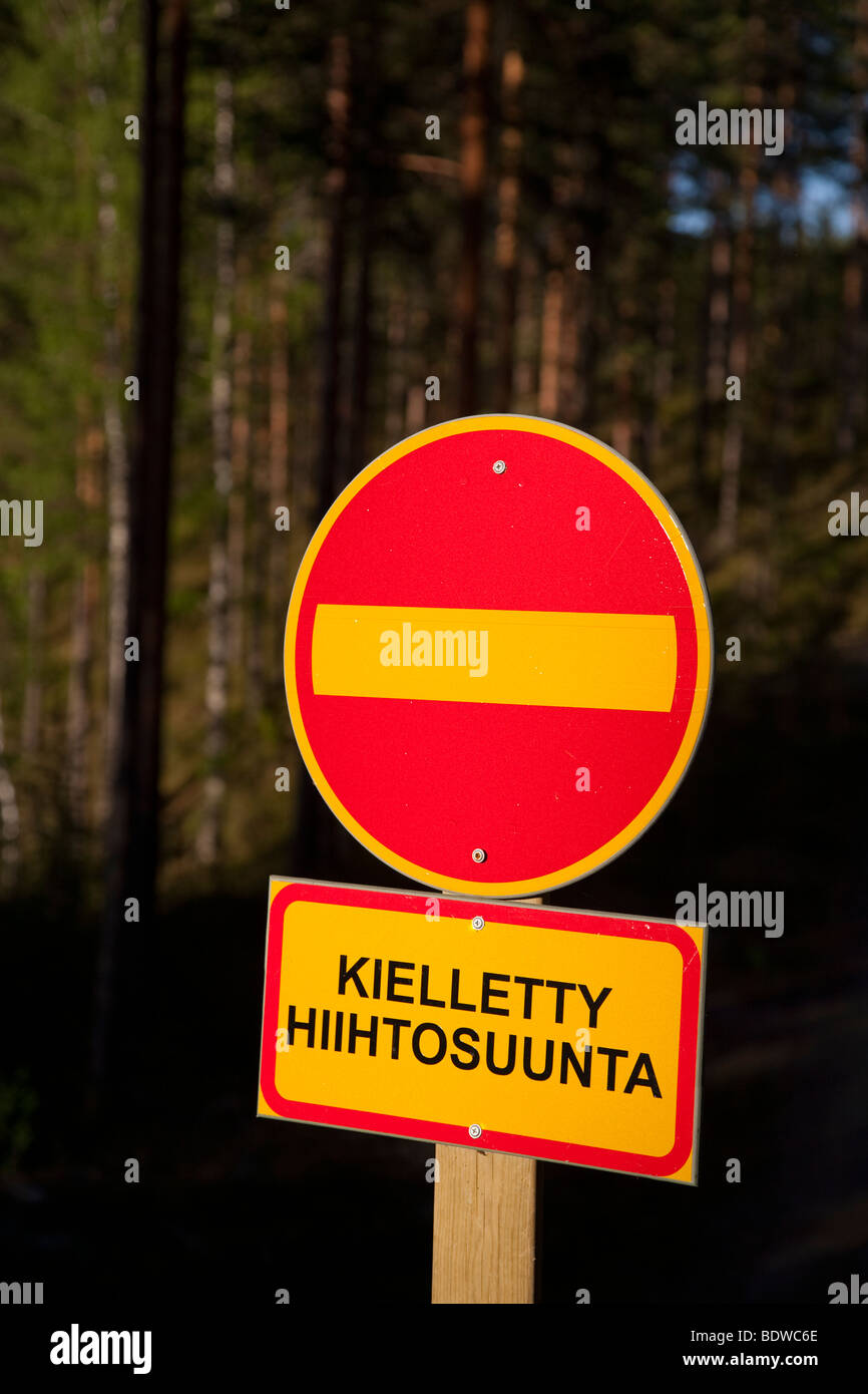 Finnish traffic sign ( No entry ) plus text warning about wrong skiing ...