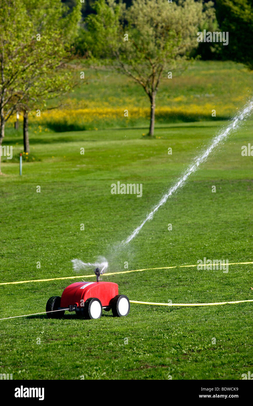 Automatic red mobile water sprinkler hi-res stock photography and ...