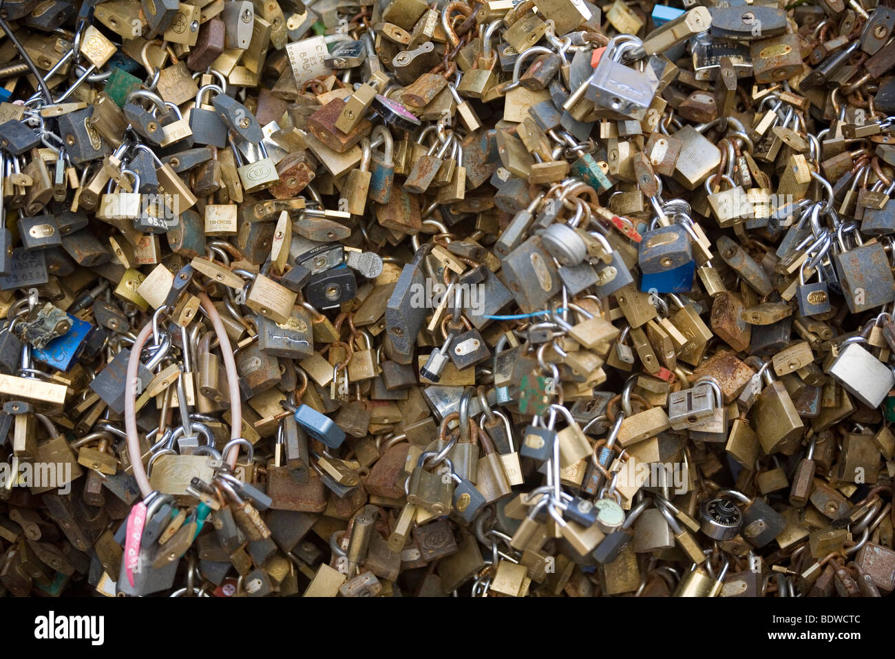 A wall and fence covered in padlocks in Pecs, Hungary Stock Photo - Alamy