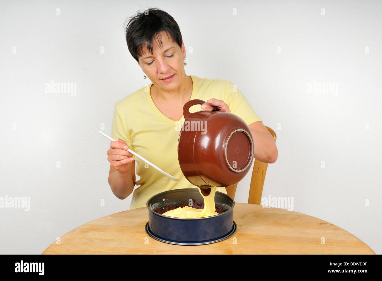 Woman baking a cake Stock Photo - Alamy