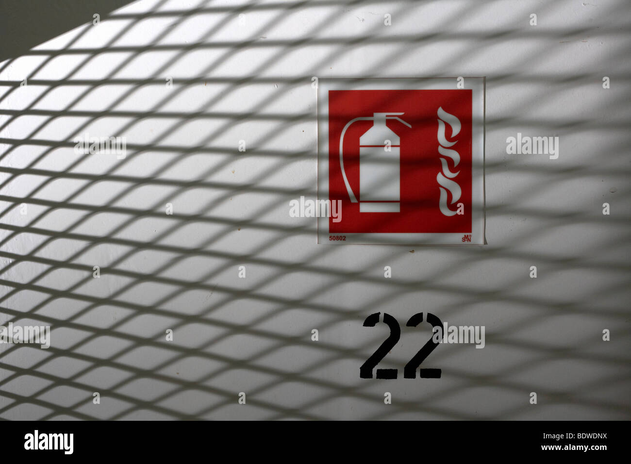 Fire extinguisher sign, shadow Stock Photo - Alamy