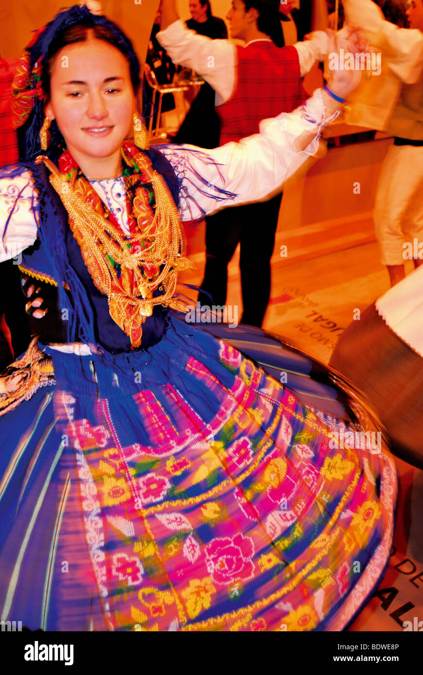 Girl of Ponte de Lima dancing folkloric dance of northern Portugal at ...