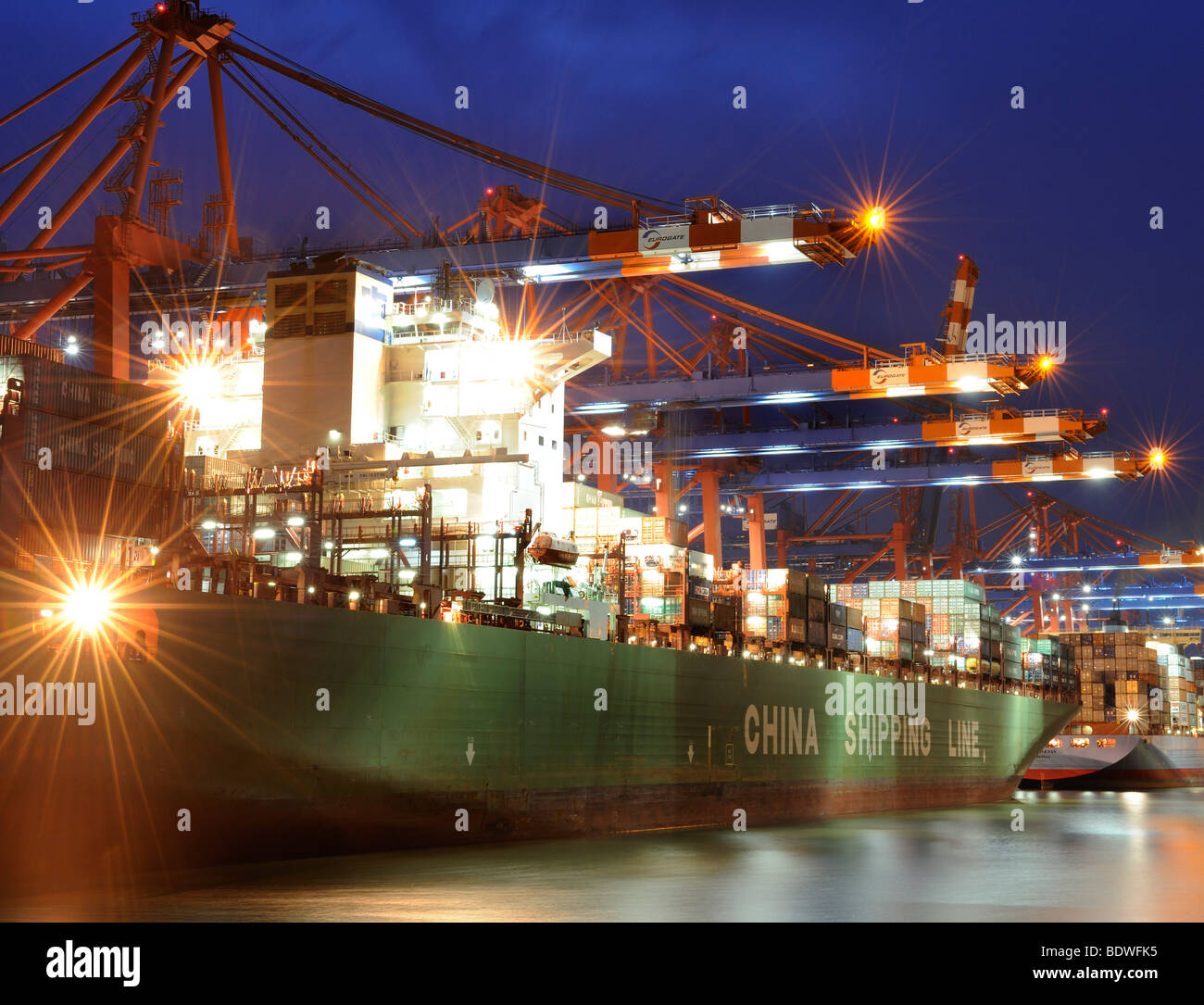 Loading a container ship at the Eurogate terminal, Hamburg, Germany ...