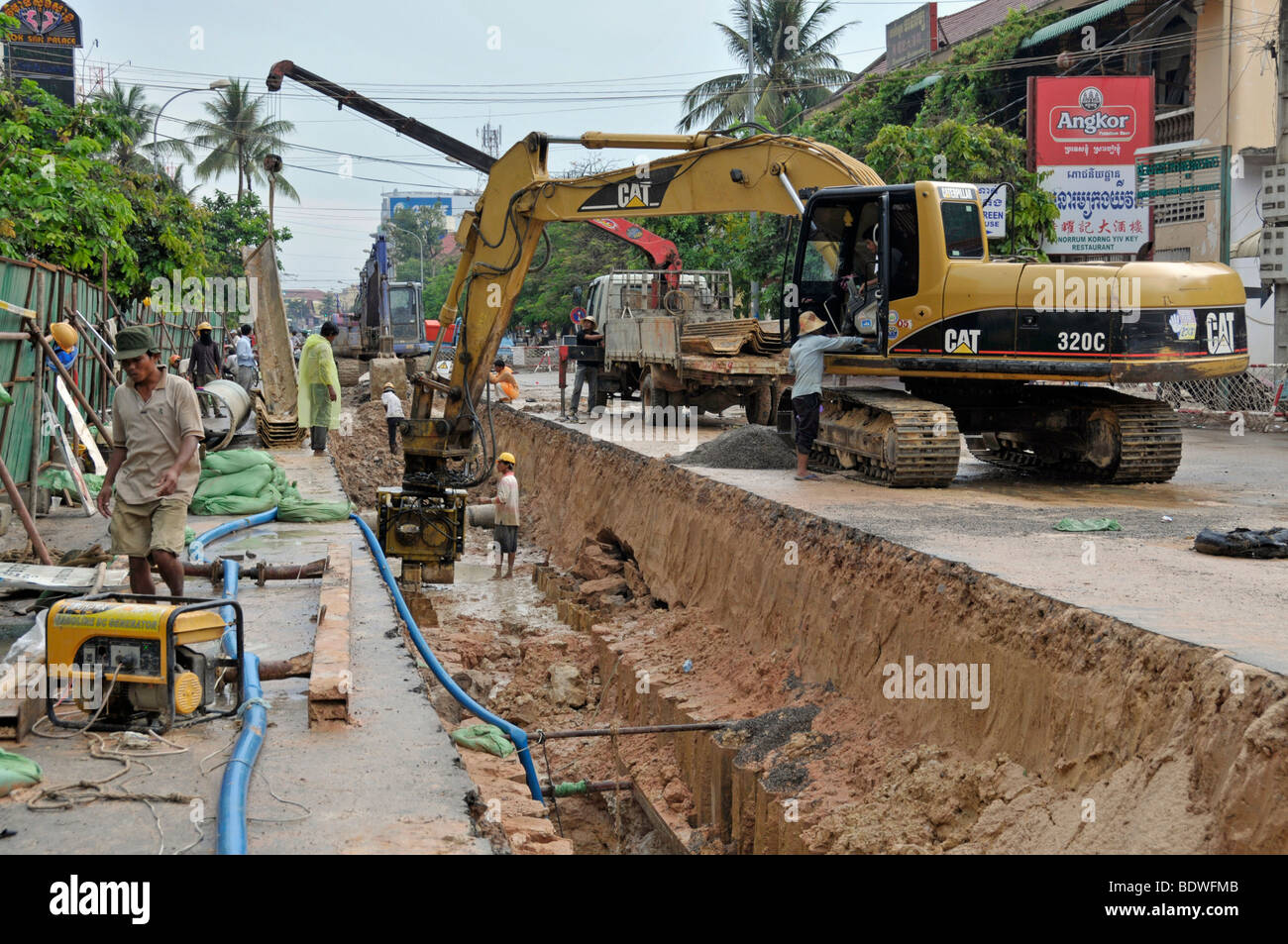 Removal of sheet pile walls, construction workers on a construction ...