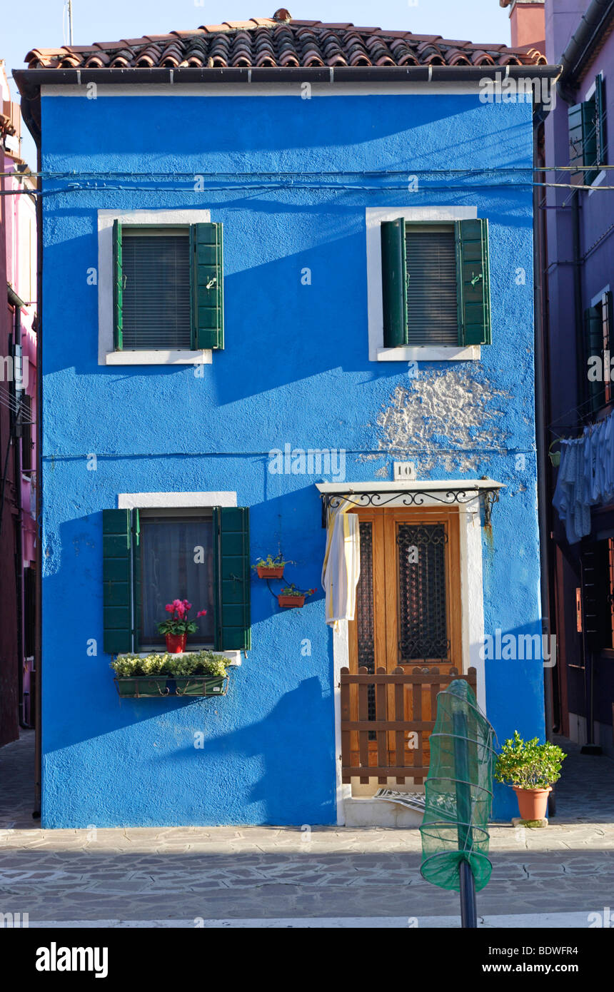 Brightly painted blue house on Burano island in the Venice lagoon ...