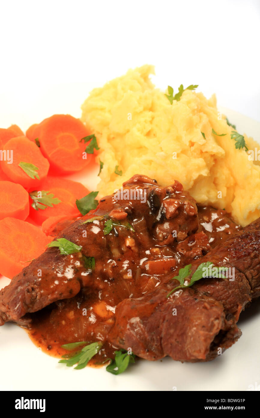 A meal of traditional British stuffed 'beef olive' escalopes served ...
