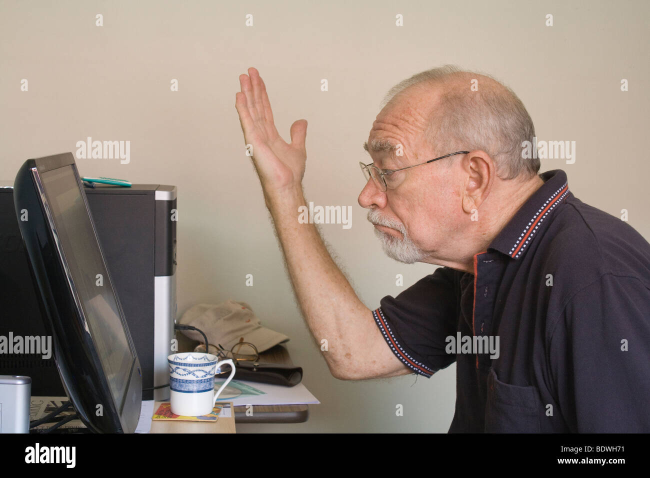 Man at computer showing emotions from puzzlement to rage Stock Photo ...
