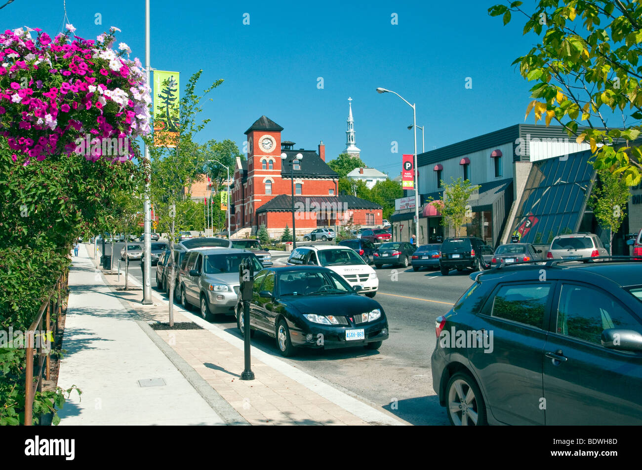 Kenora, Ontario main street with flowers, lamp posts and traffic Stock ...