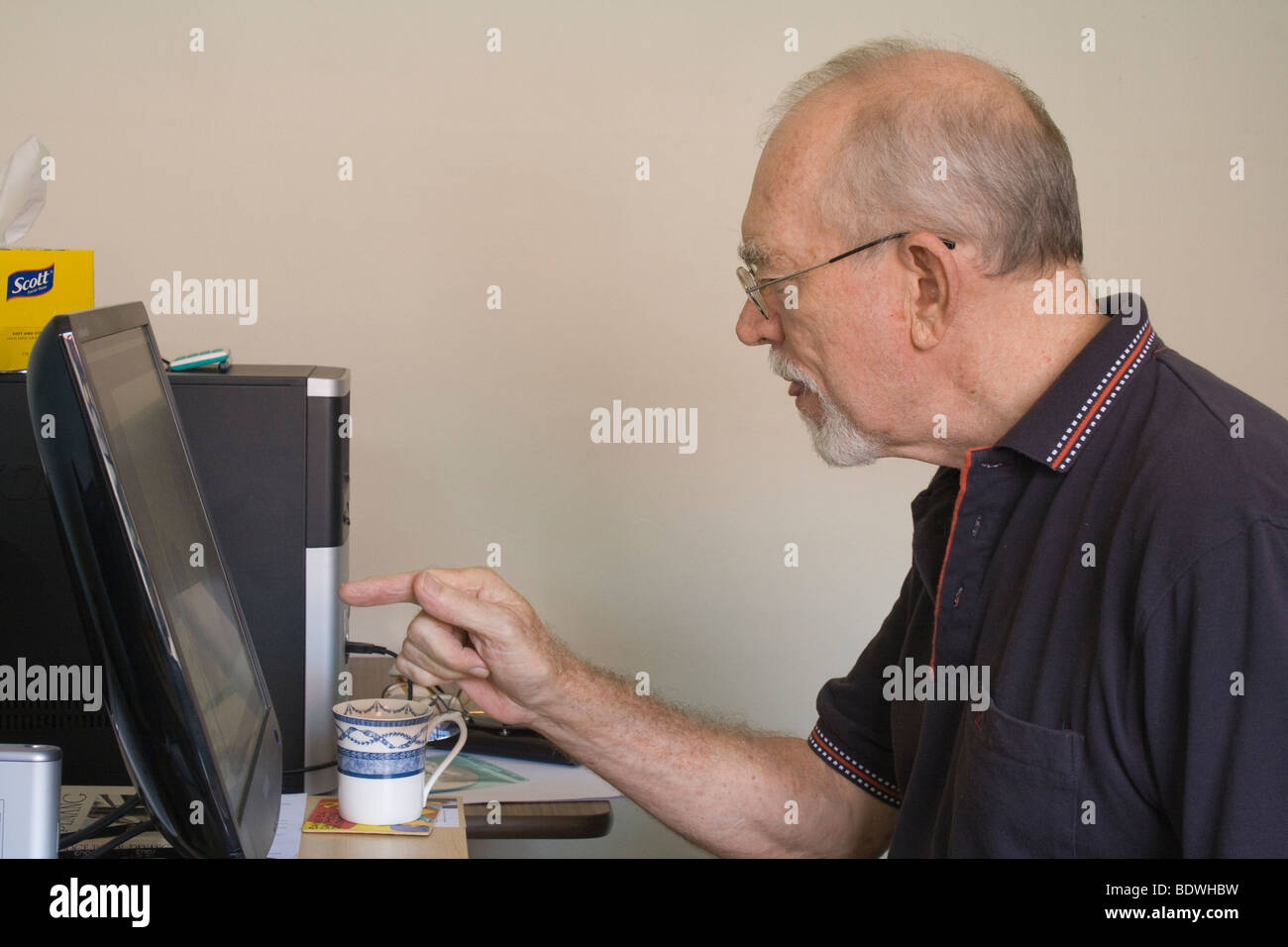 Man at computer showing emotions from puzzlement to rage Stock Photo ...