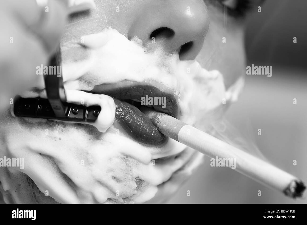 Close-up of a woman smoking a cigarette, wet shaving Stock Photo - Alamy