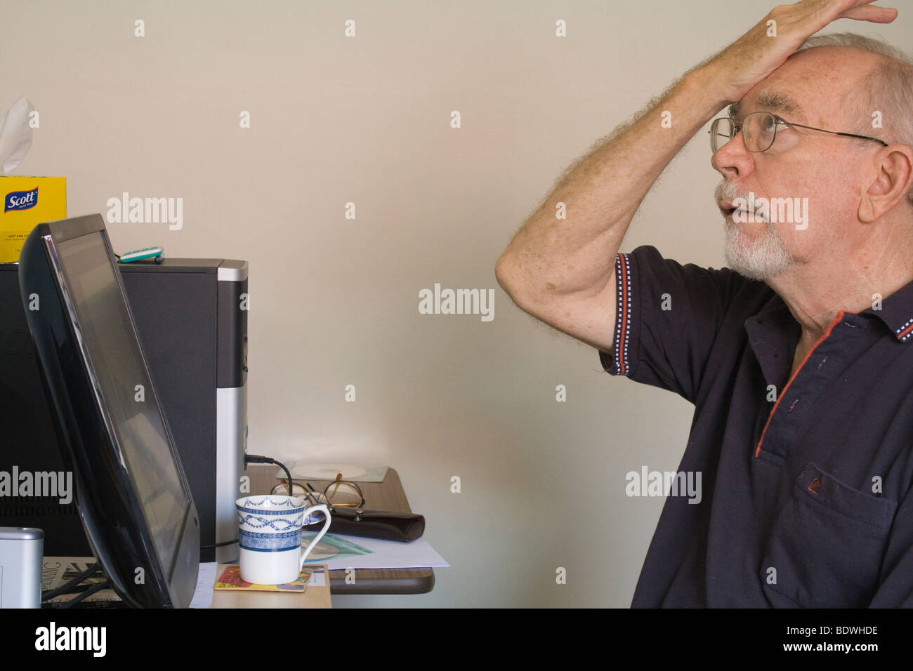 Man at computer showing emotions from puzzlement to rage Stock Photo ...