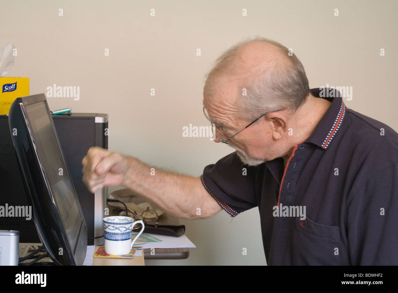 Man at computer showing emotions from puzzlement to rage Stock Photo ...